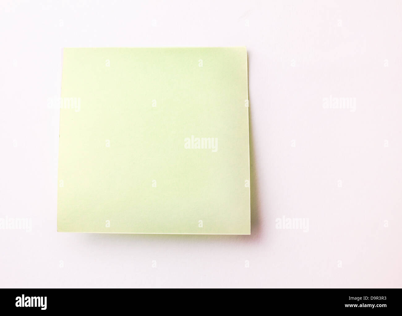 Blank Sticky Note on white wall Stock Photo - Alamy