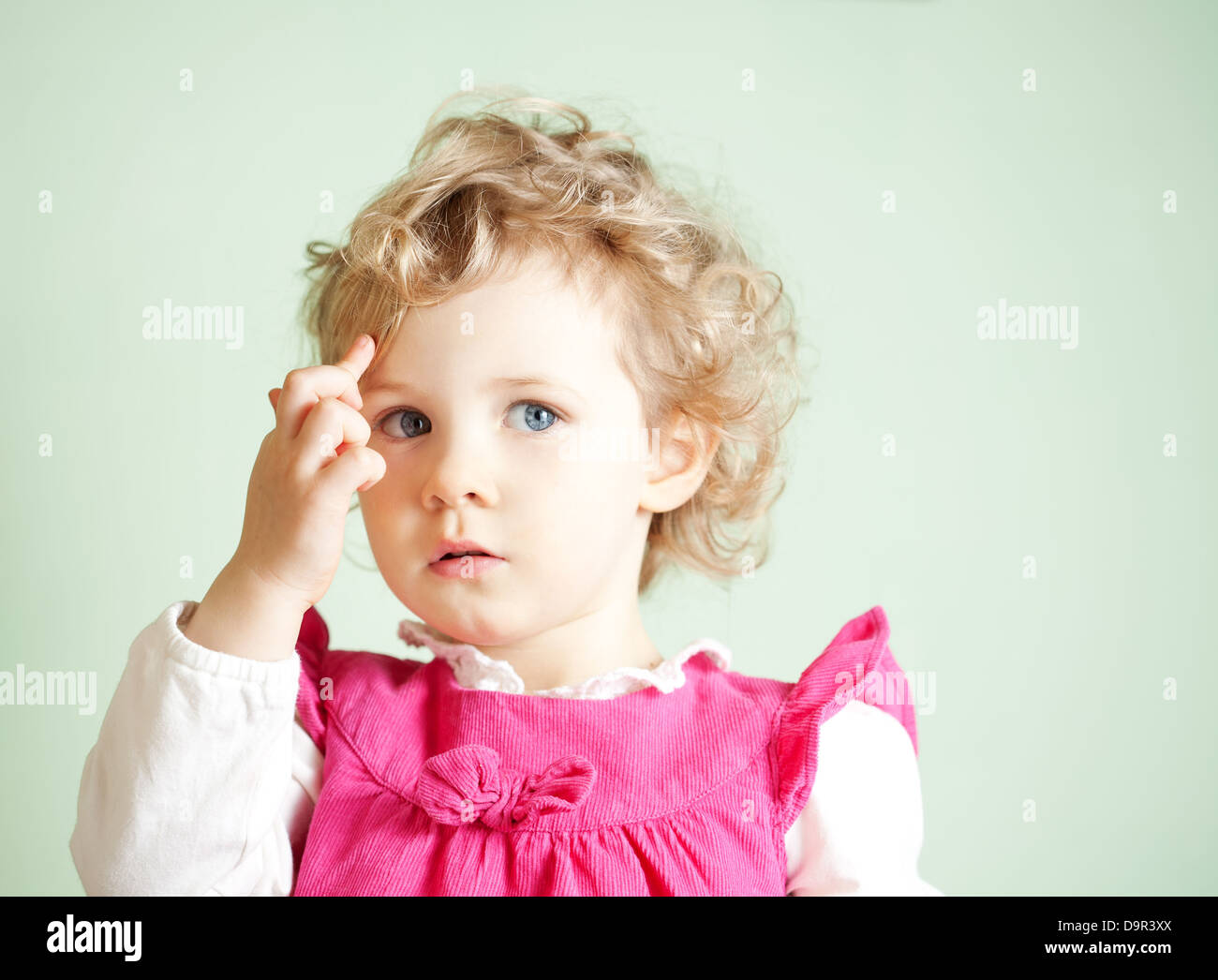 Little girl thinking Stock Photo - Alamy