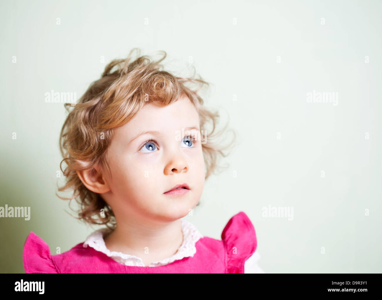 Little girl looking up expression hi-res stock photography and images ...