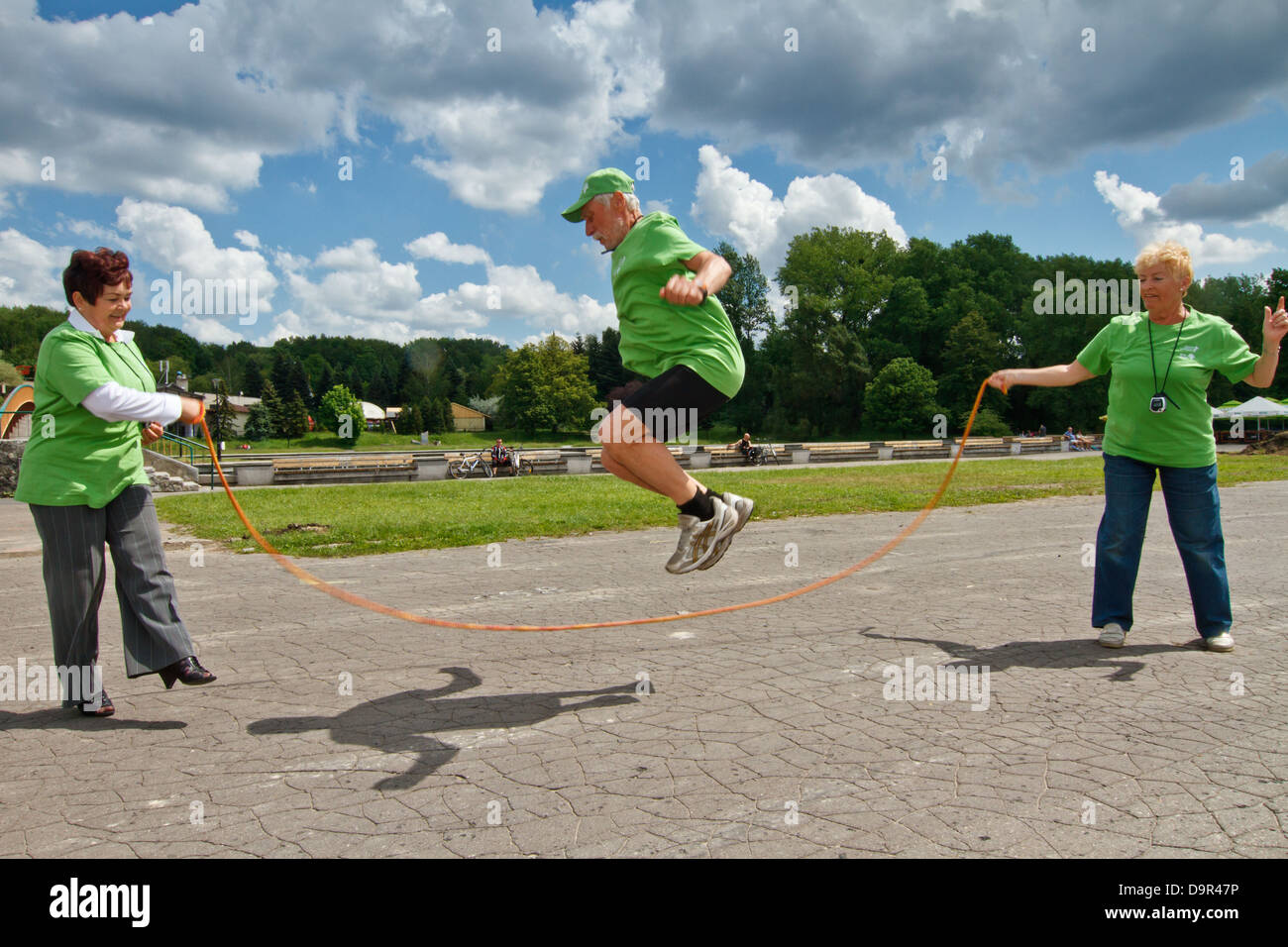 Adult man jumping over a skipping rope Stock Photo - Alamy