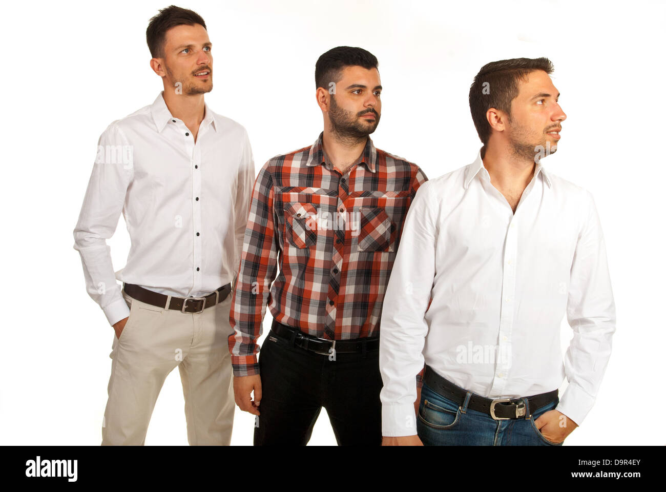 Three business men in a row looking away isolated on white background ...