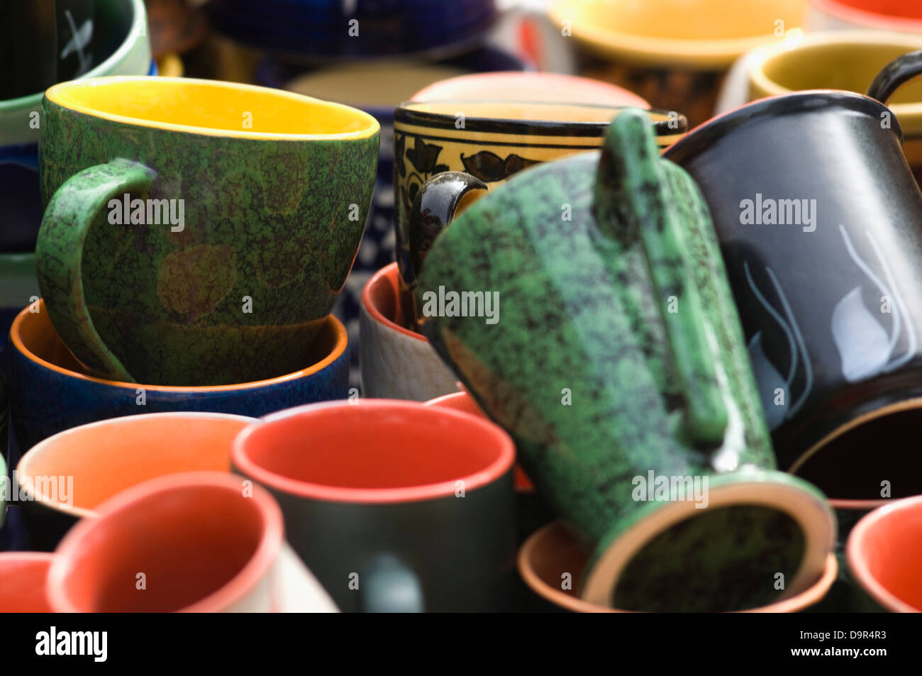 Close-up of assorted cups for sale at market stall Stock Photo - Alamy