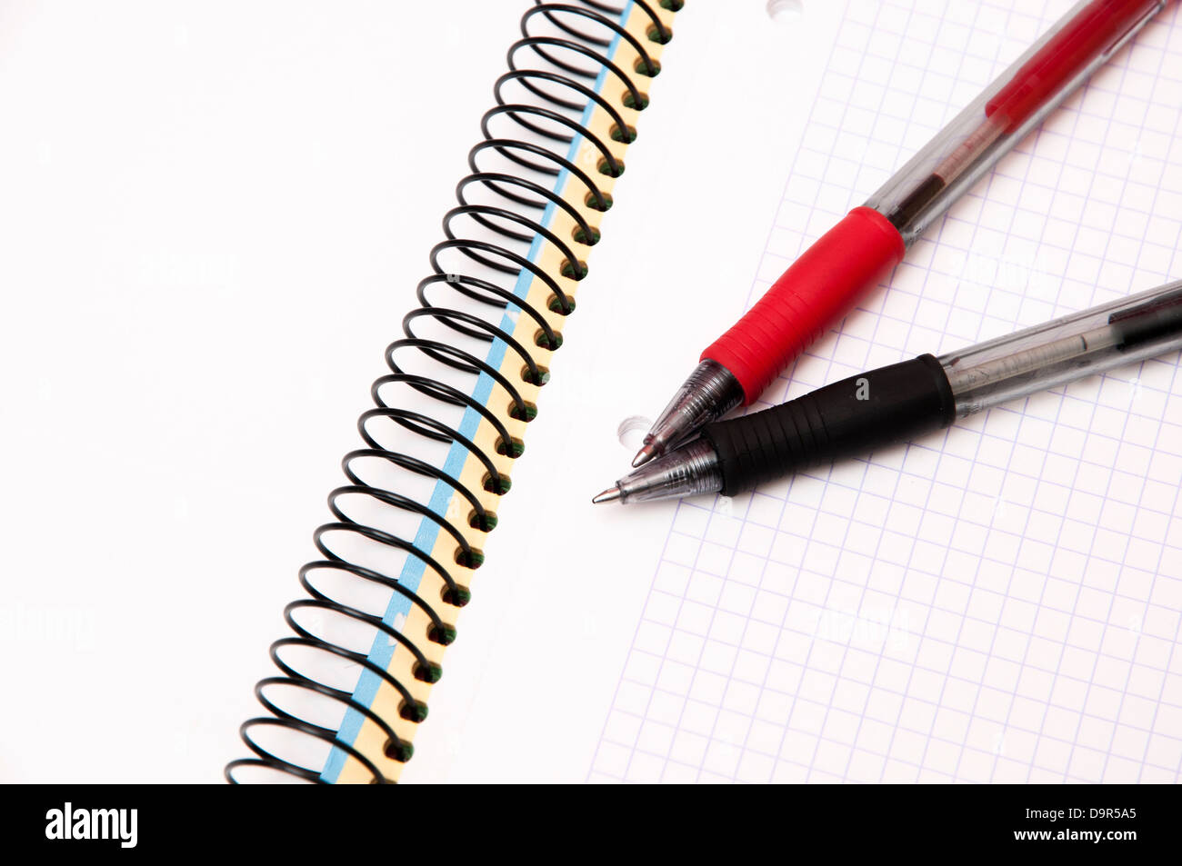 notebook with color pens on white background Stock Photo - Alamy