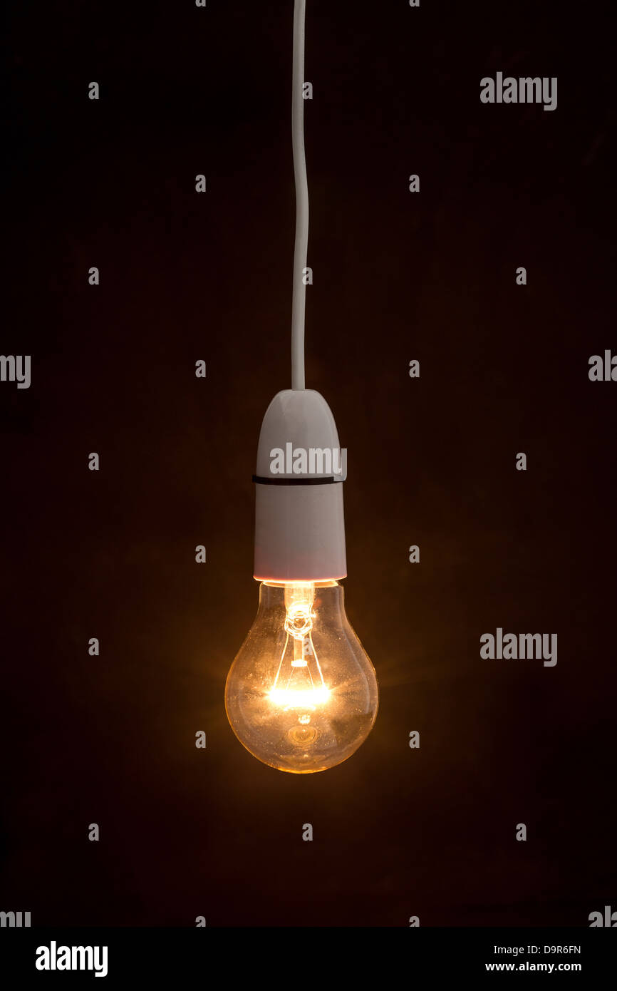 Bright light bulb turned on Stock Photo - Alamy