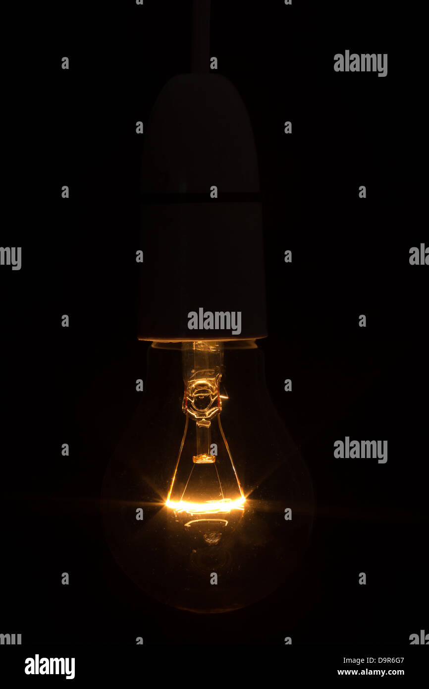 Close up of bright light bulb in the dark Stock Photo - Alamy