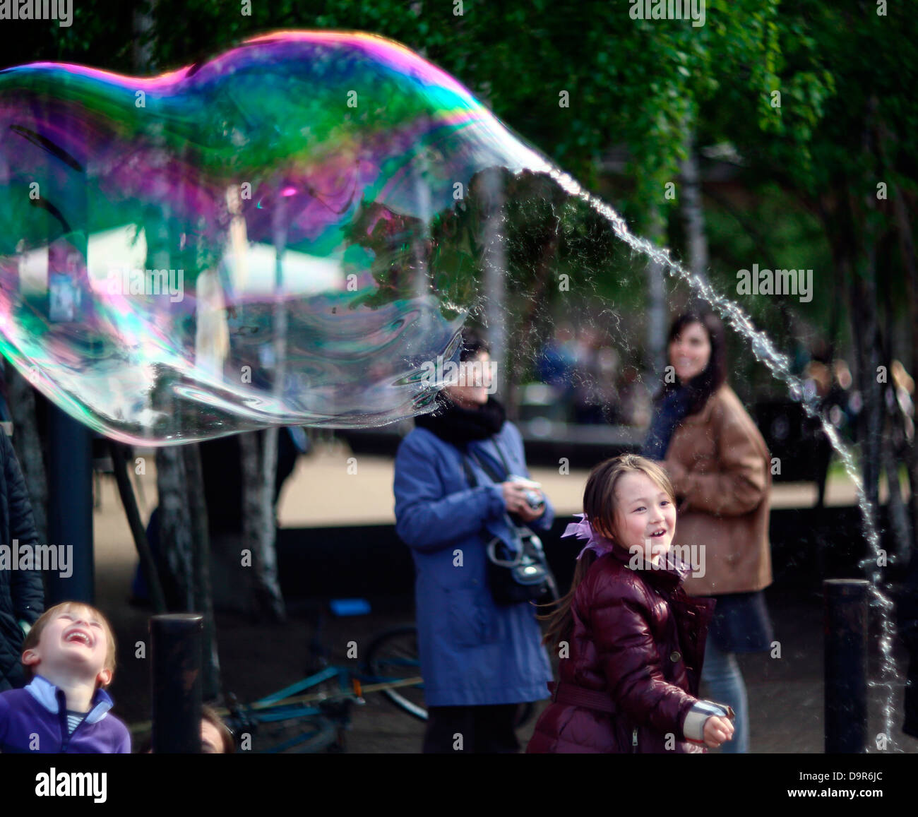 children enjoy giant bubble Stock Photo - Alamy