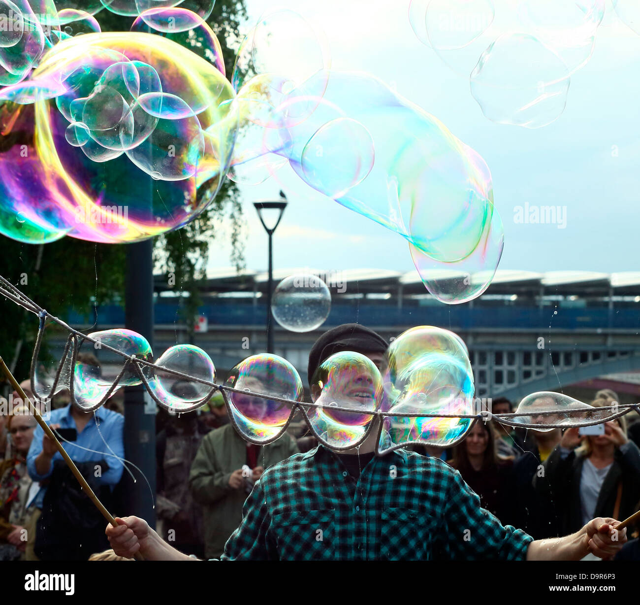 entertainer with giant bubbles Stock Photo - Alamy