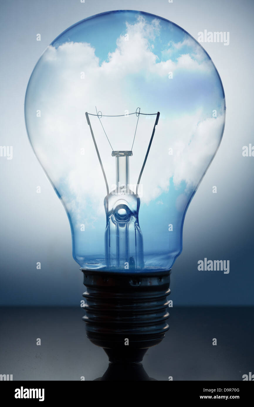 Close up of big light bulb standing with bright blue sky in it Stock ...