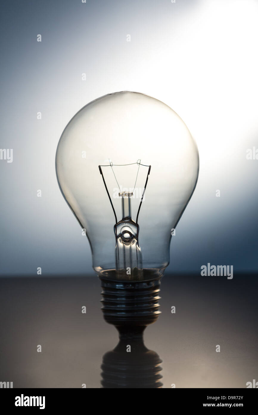 Big bright light bulb standing Stock Photo - Alamy