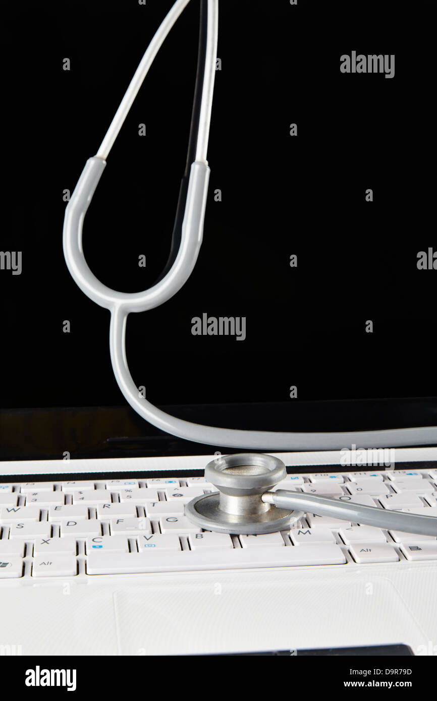 Stethoscope on laptop computer Stock Photo - Alamy