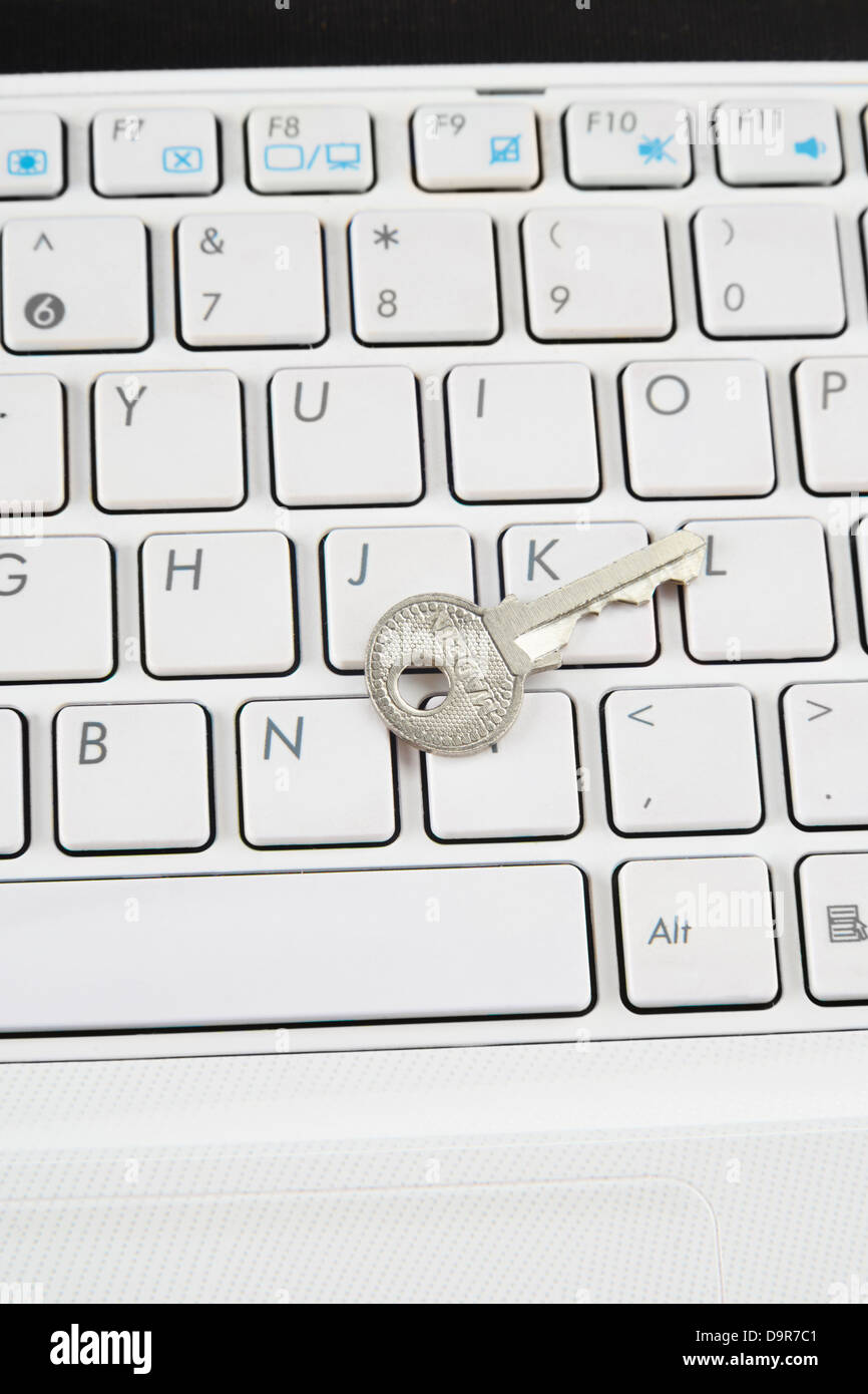 Key on laptop computer Stock Photo - Alamy