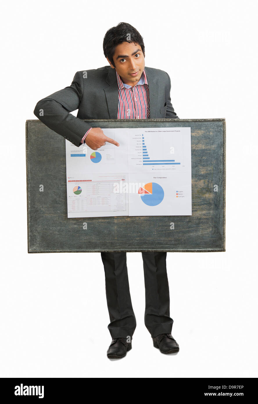 Portrait of a businessman pointing at a chart Stock Photo - Alamy