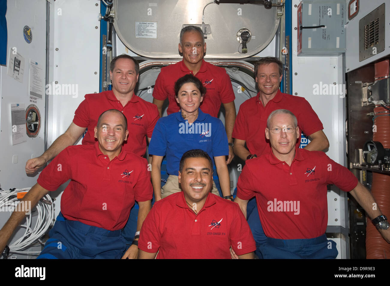 The crew of NASA's STS-128 mission poses for a photo aboard the ...