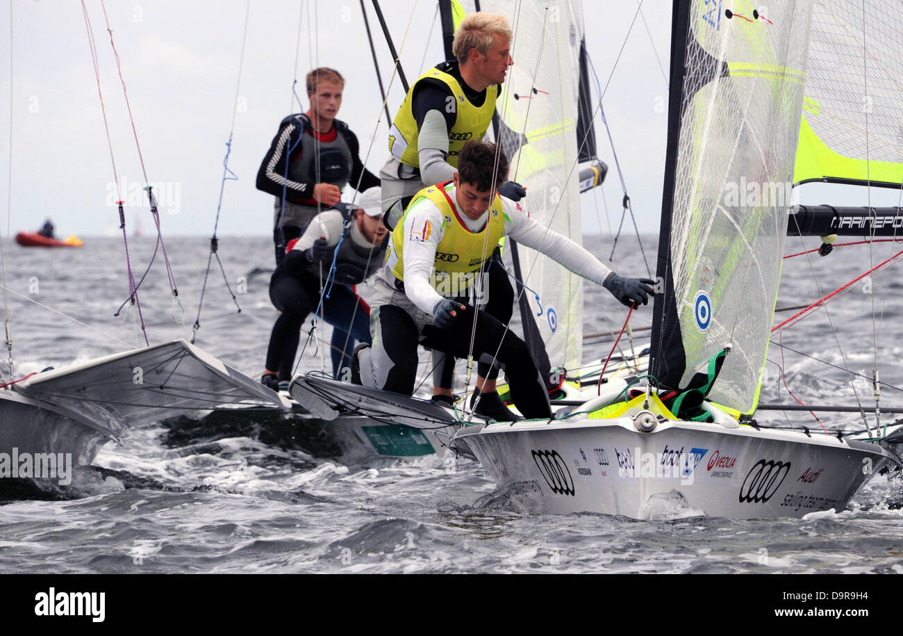 German yachtsmen Erik Heil (TOP IN RIGHT BOAT) and Thomas Ploessel ...