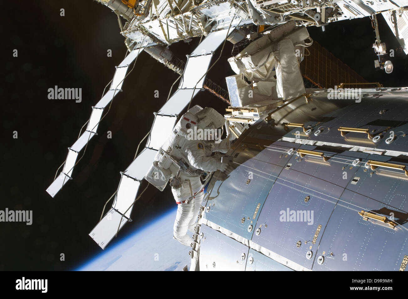 Nicole Stott participates in the first extravehicular activity (EVA) of ...