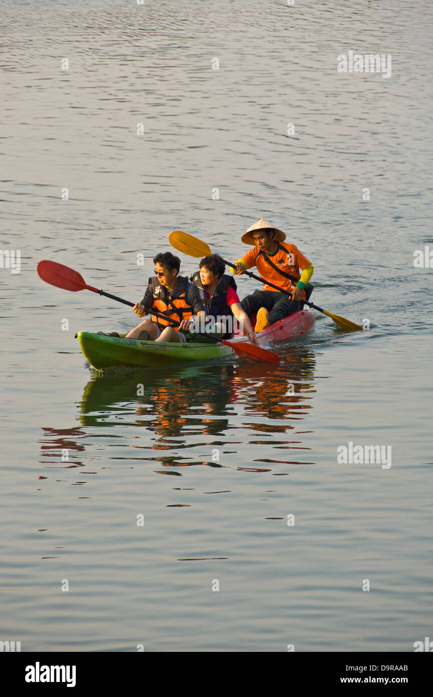 Vertical view of people kayaking along the Nam Song river in Vang Vieng ...
