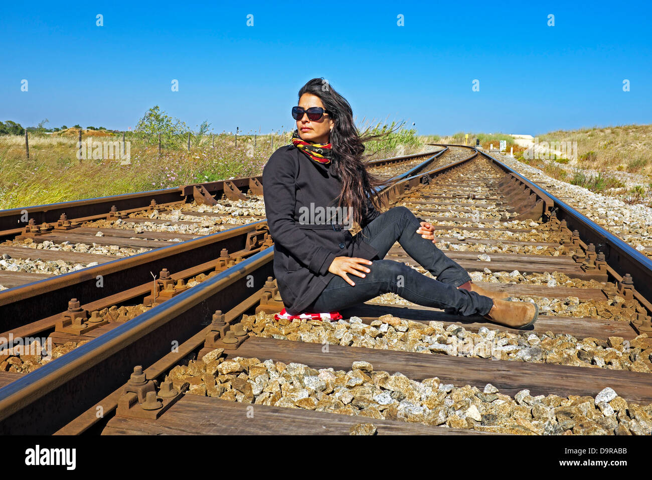 Young woman waiting railway hi-res stock photography and images - Alamy