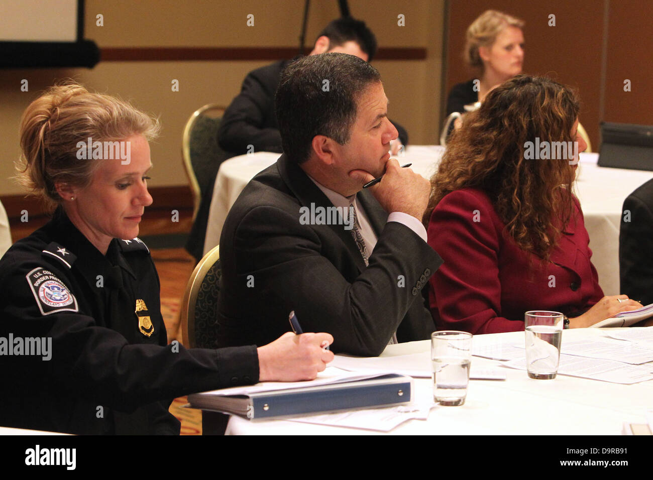 This image features a trade round table discussion in Seattle, focusing ...