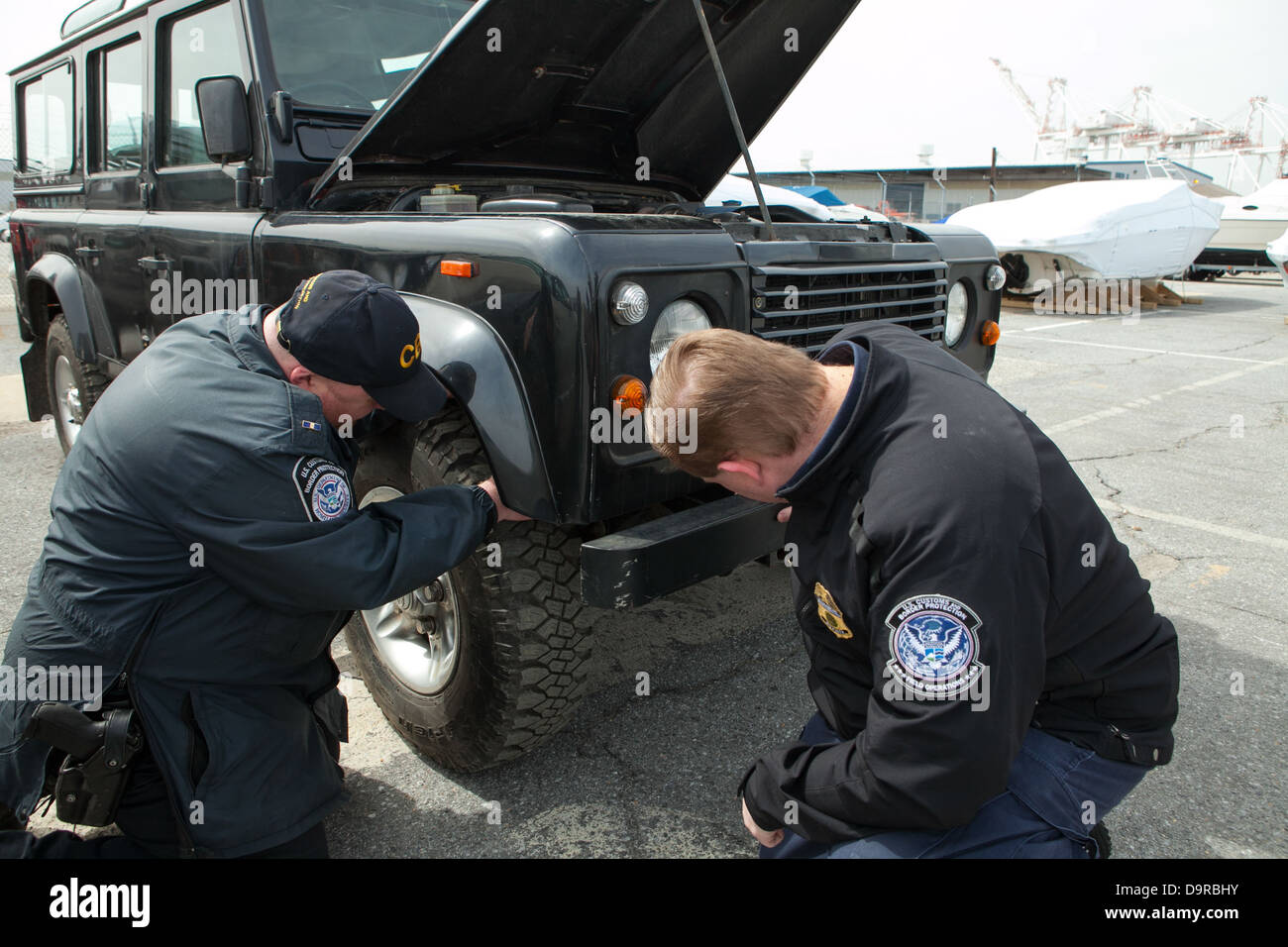 U.S. Customs and Border Protection officers conducting an inspection of ...