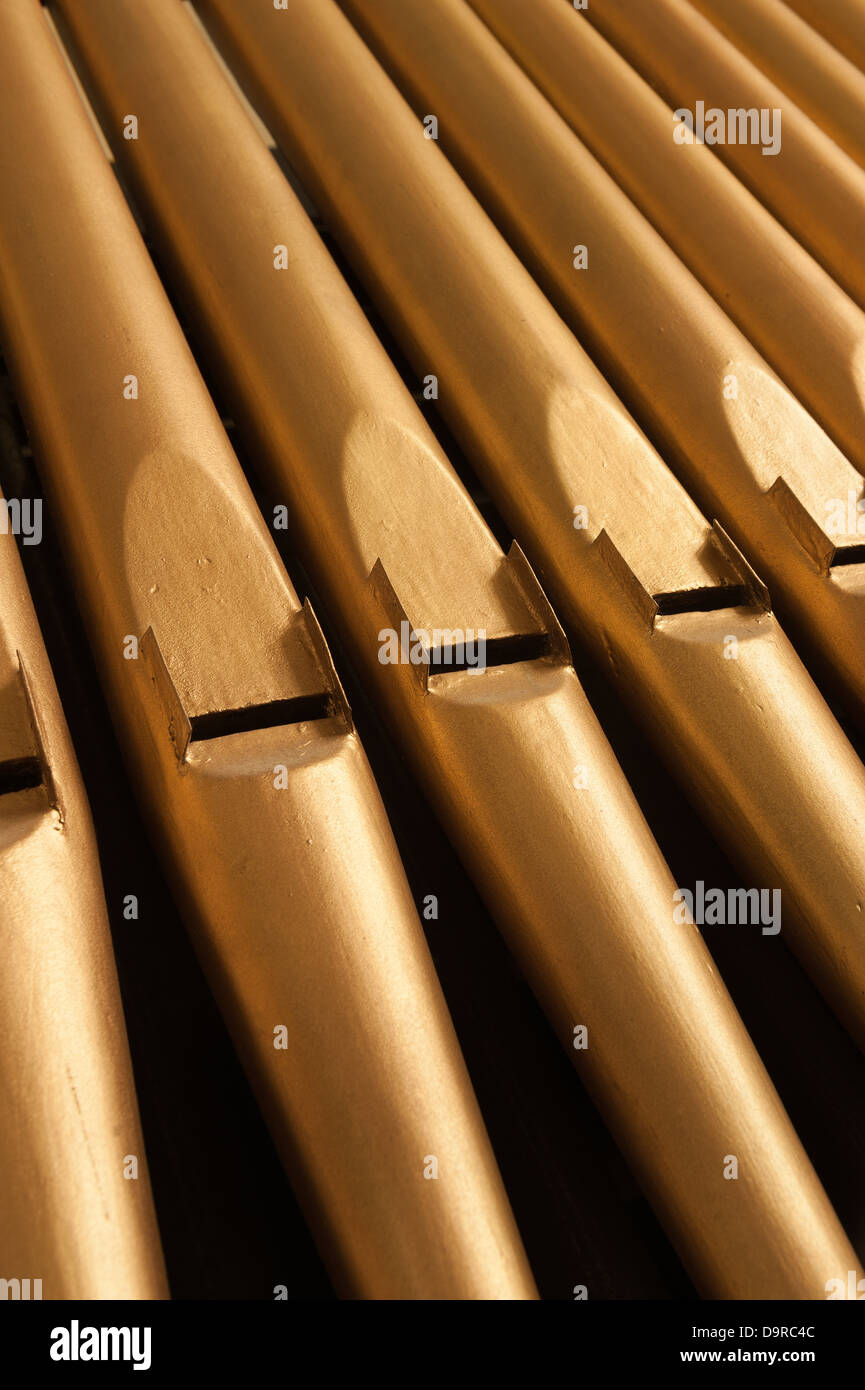 gold painted paint wooden metal church organ pipes wind instrument ...