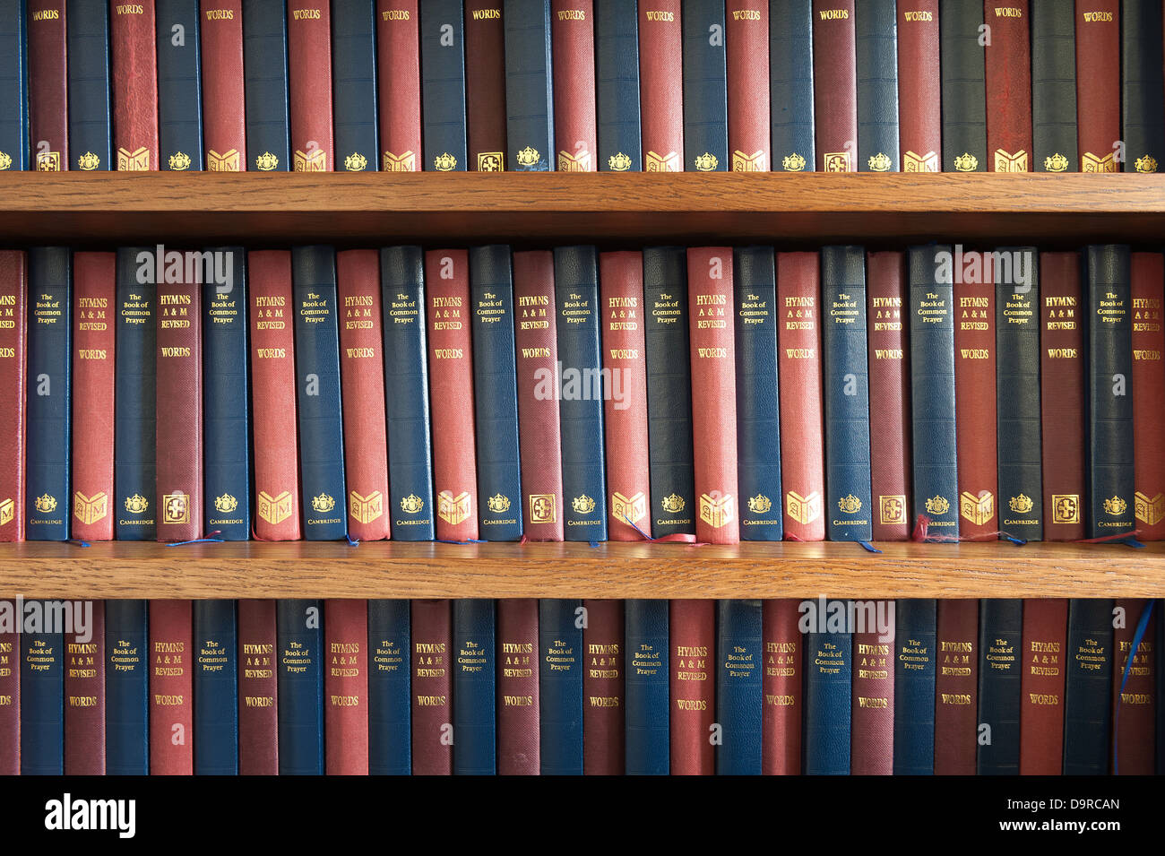 rows of hymn and prayer worship books alternating color neat order on ...