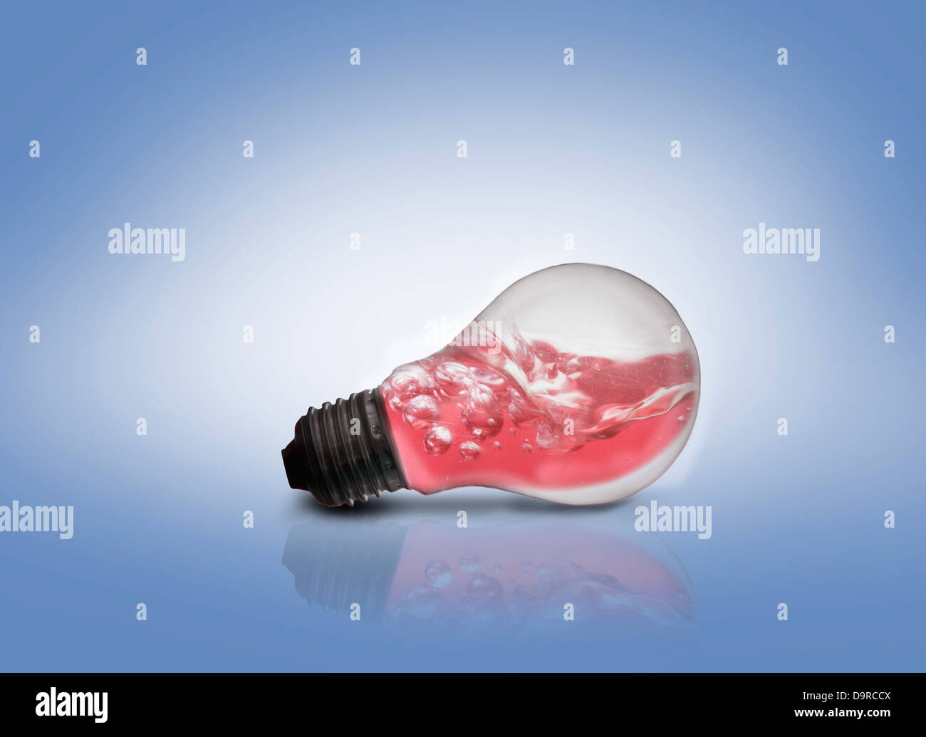 Light bulb with red water inside Stock Photo - Alamy
