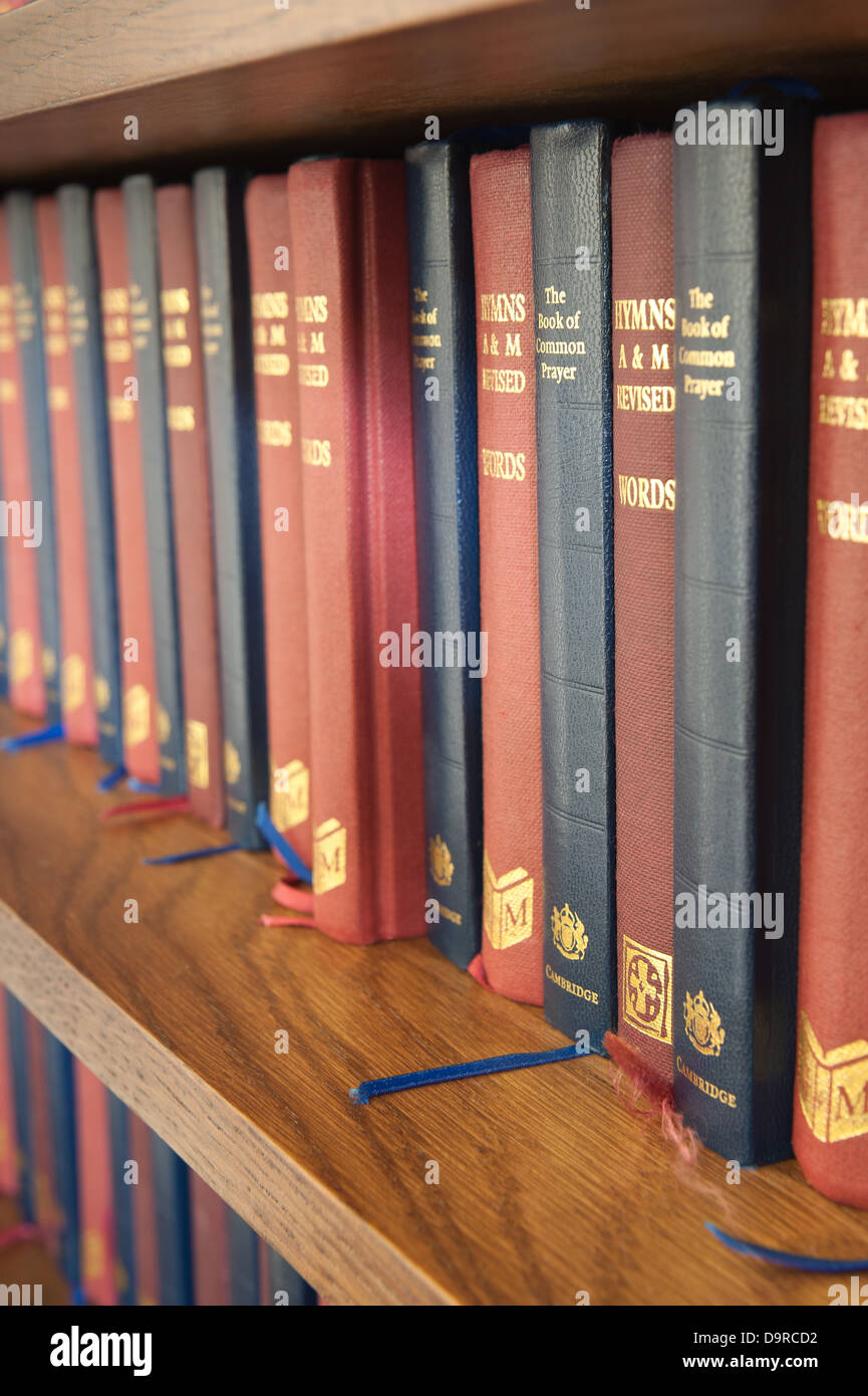 rows of hymn and prayer worship books alternating color neat order on ...