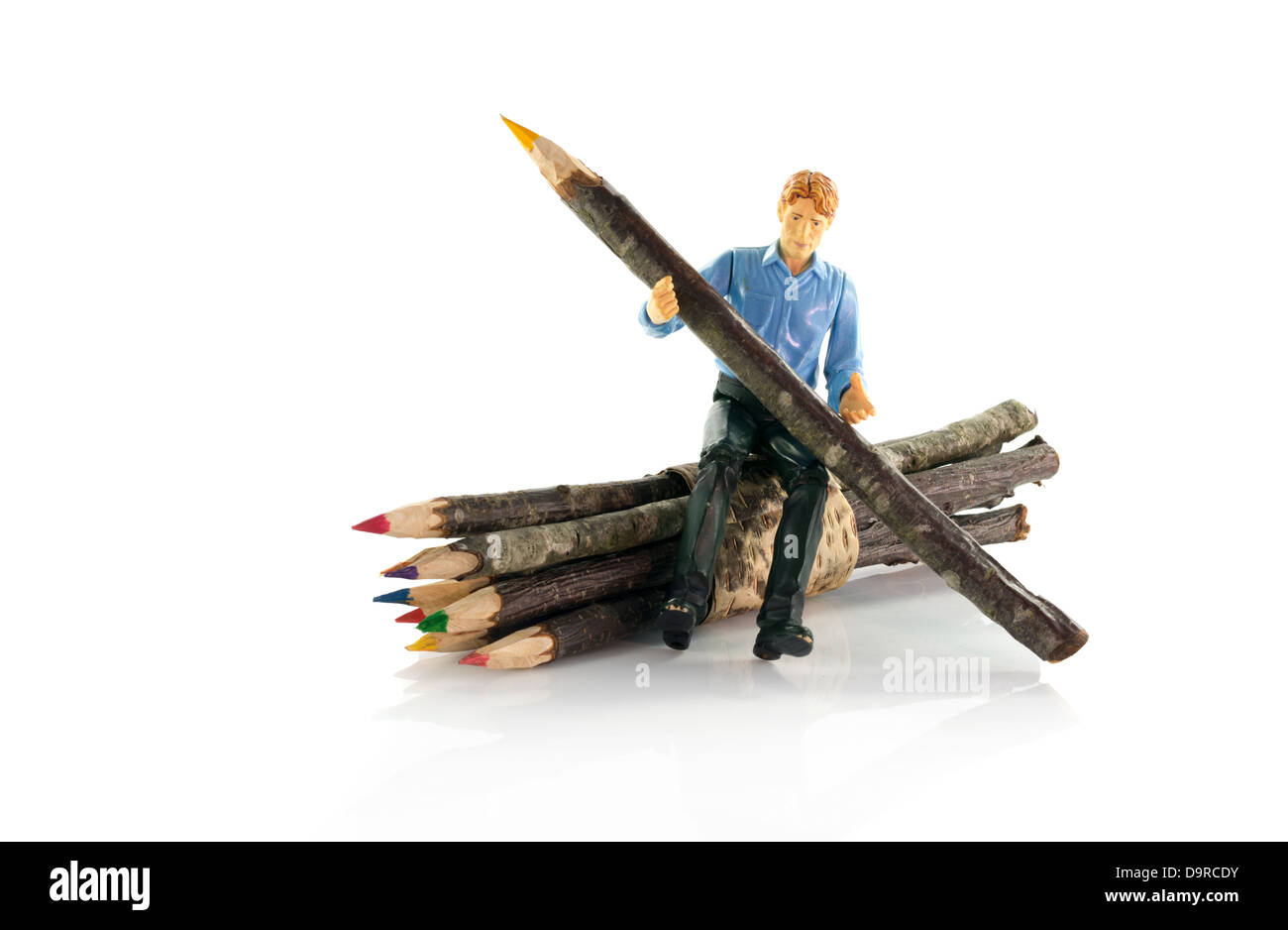 puppet man sitting on bunch of wooden pencils from tree Stock Photo - Alamy