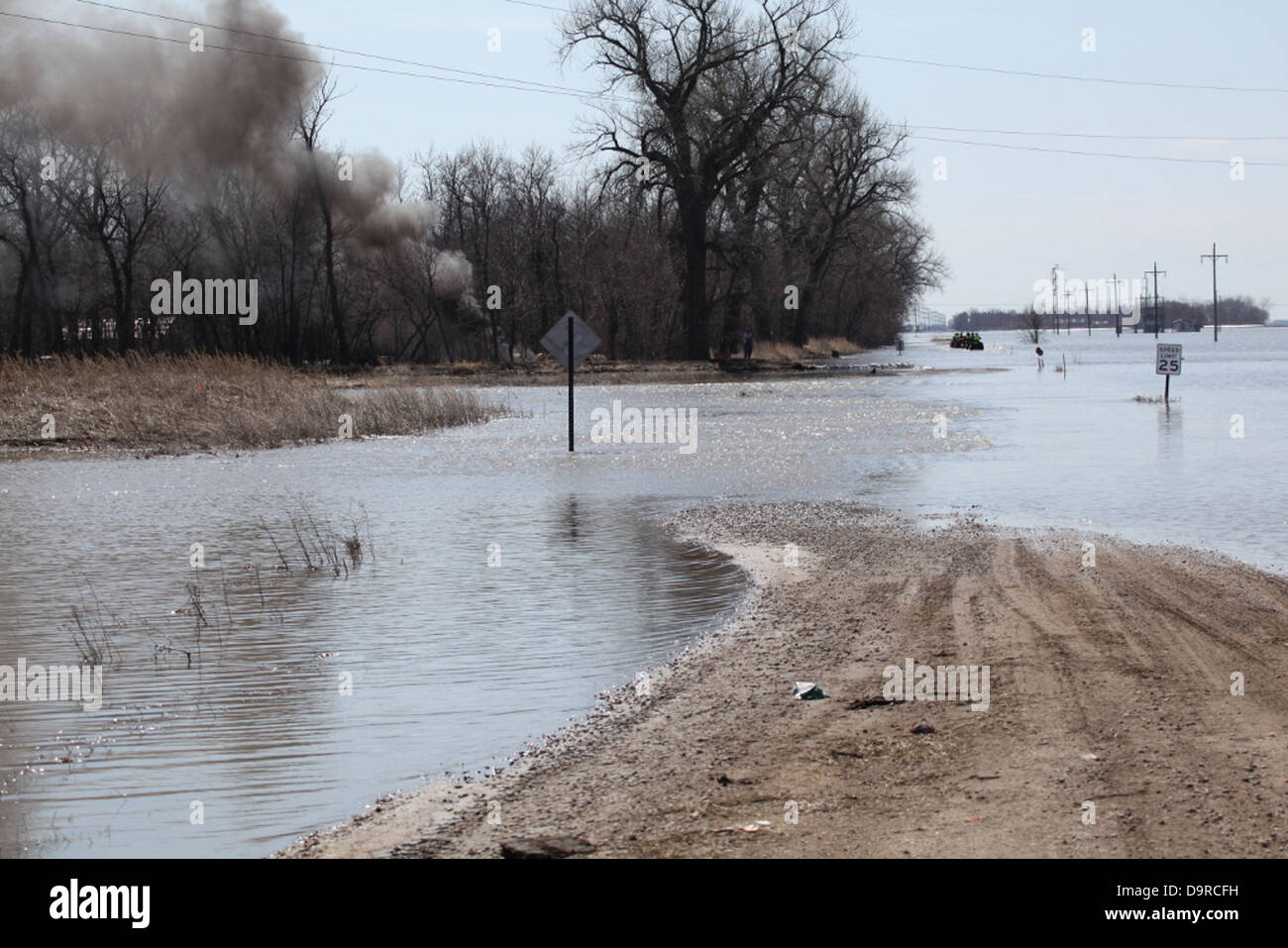 This image from the Red River in Harwood, ND, shows a flooded road ...