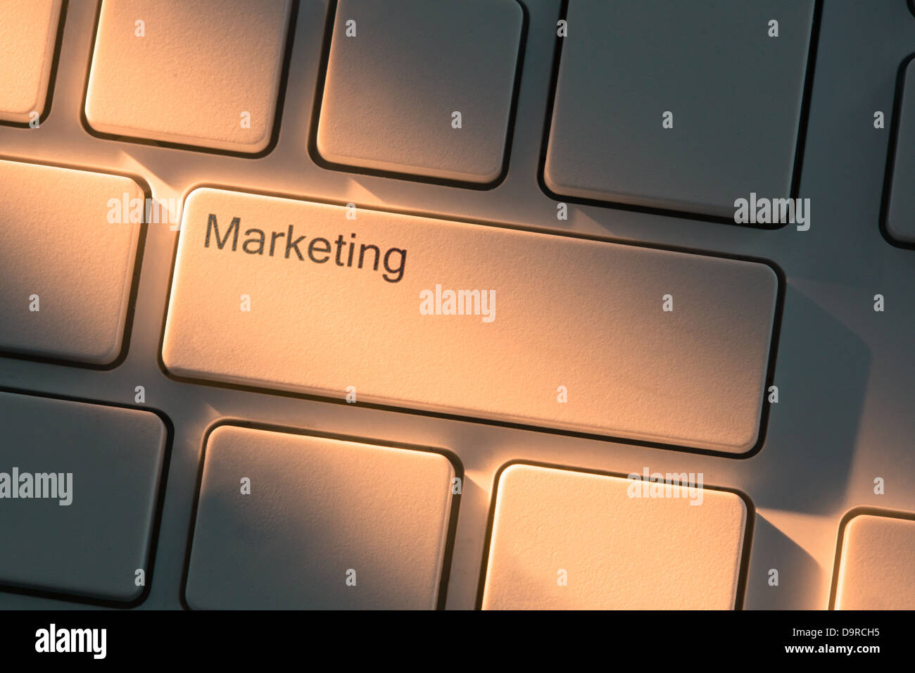 Keyboard with close up on marketing button Stock Photo - Alamy