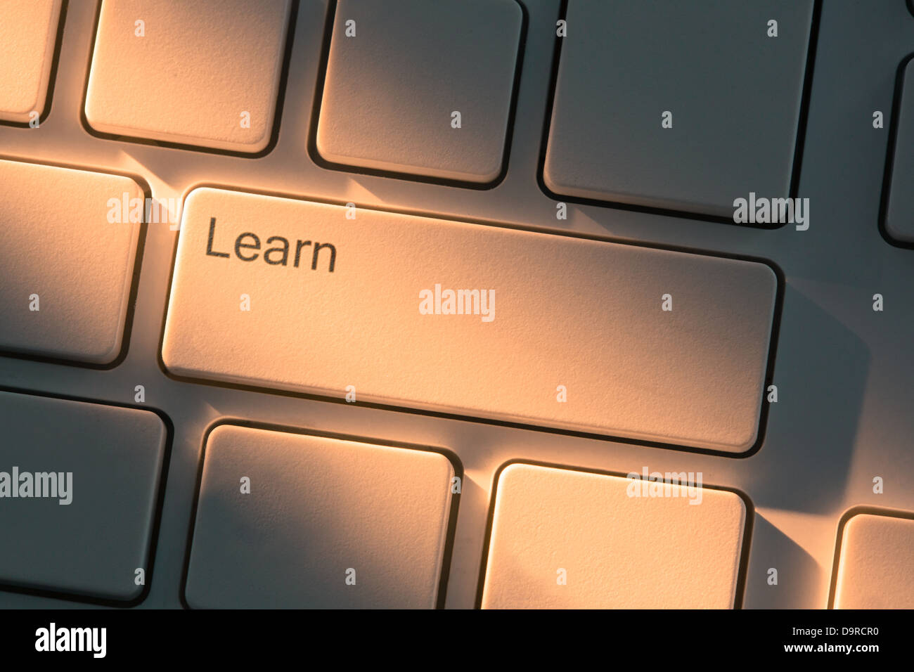 Keyboard with close up on learn button Stock Photo - Alamy