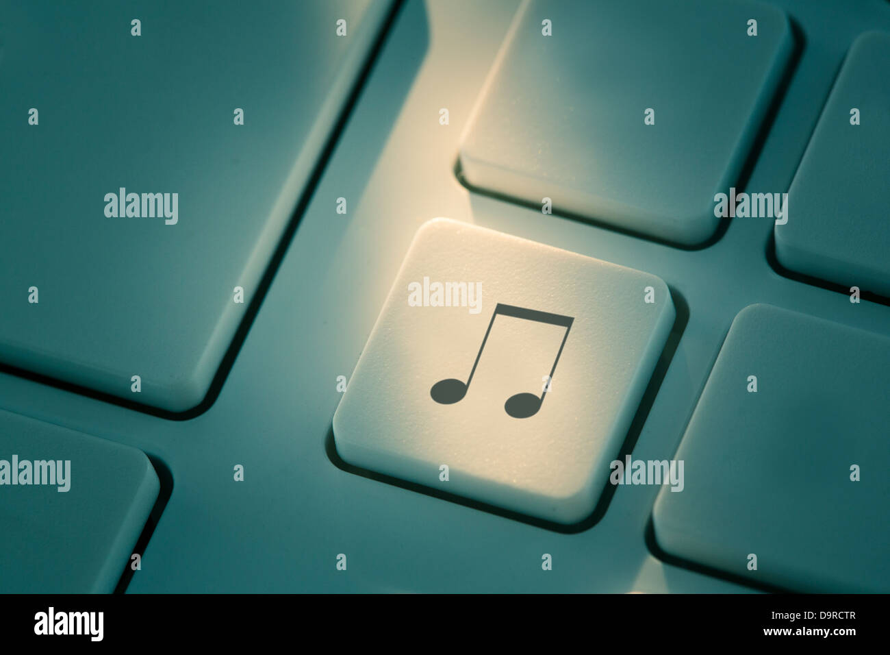 Black music note button on keyboard Stock Photo - Alamy
