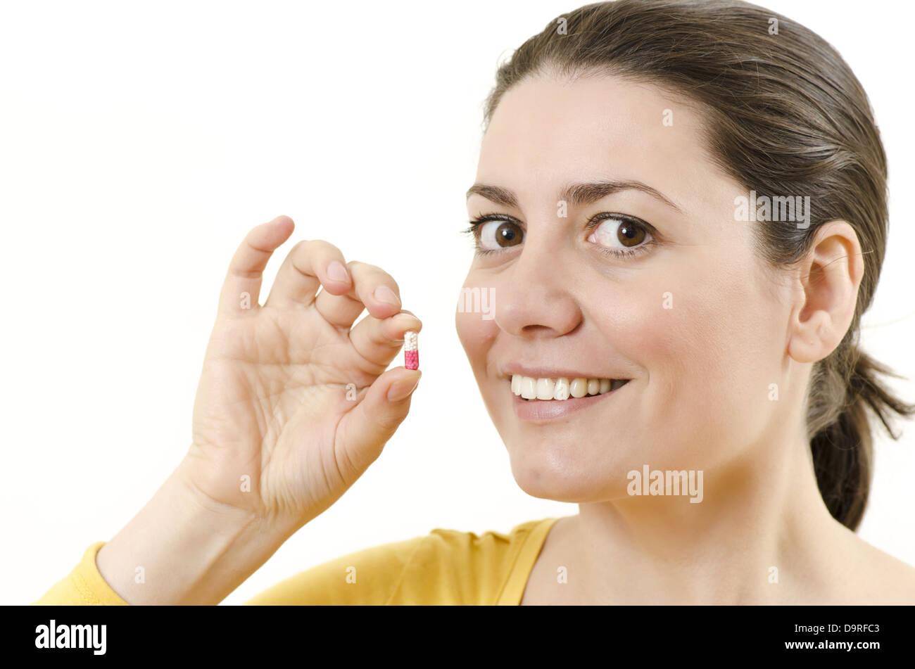 Young woman with pill Stock Photo - Alamy