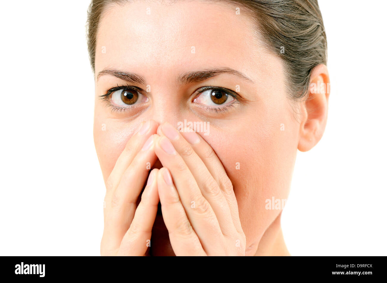 bright closeup picture of woman with hands over mouth Stock Photo - Alamy