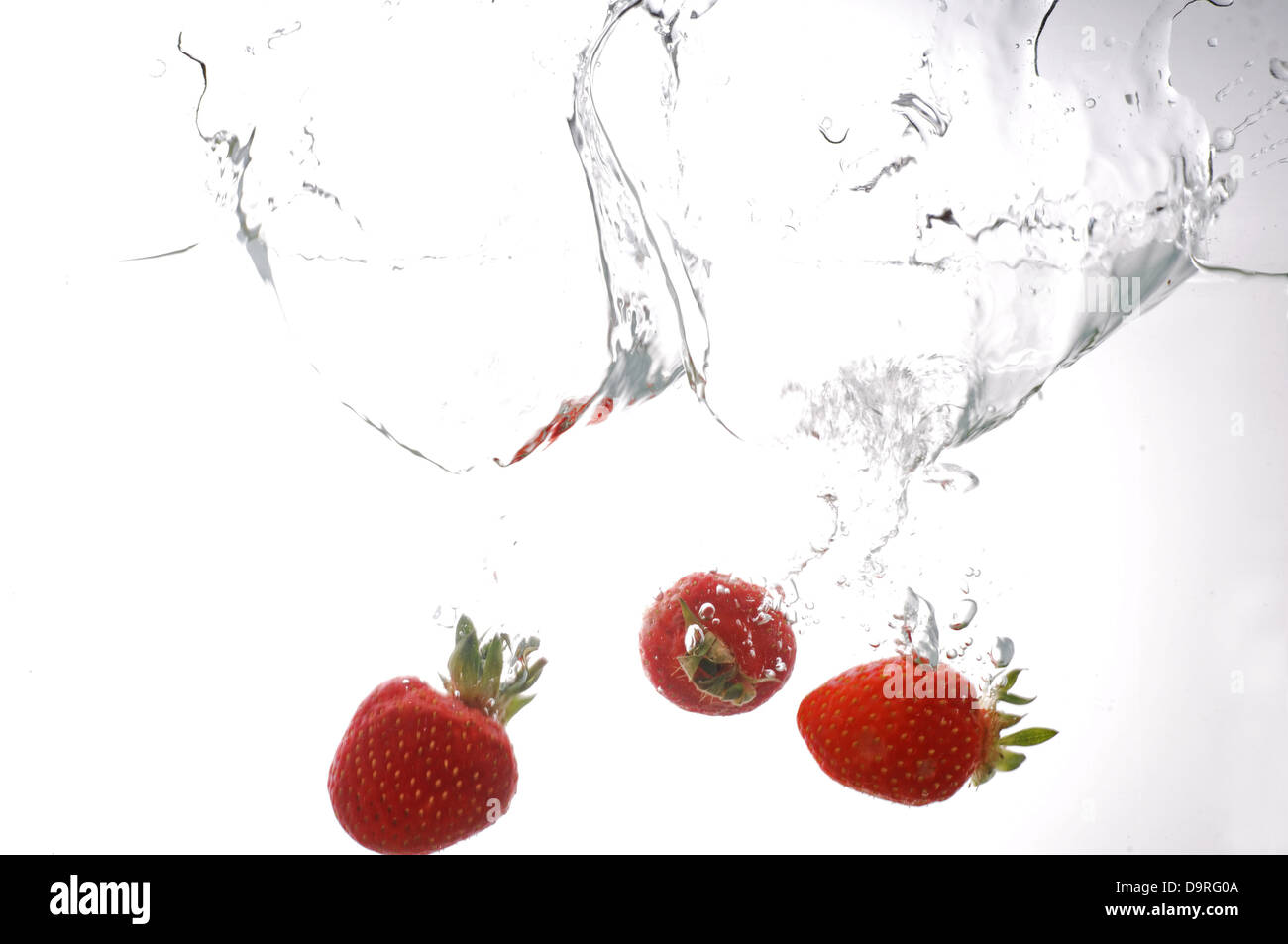 Strawberries in water Stock Photo - Alamy