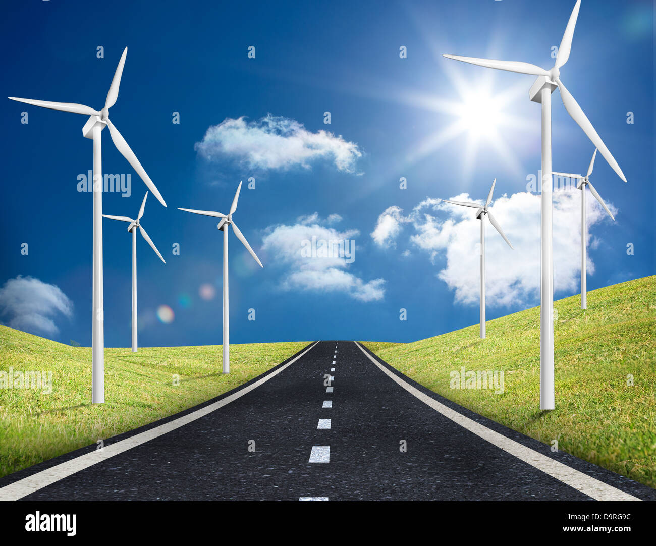 Road leading out to the horizon with wind turbines either side Stock ...