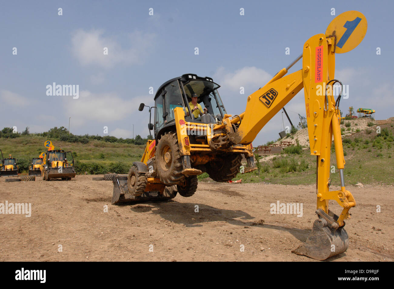 JCB racing and stunts in Diggerland Strood Kent Stock Photo - Alamy