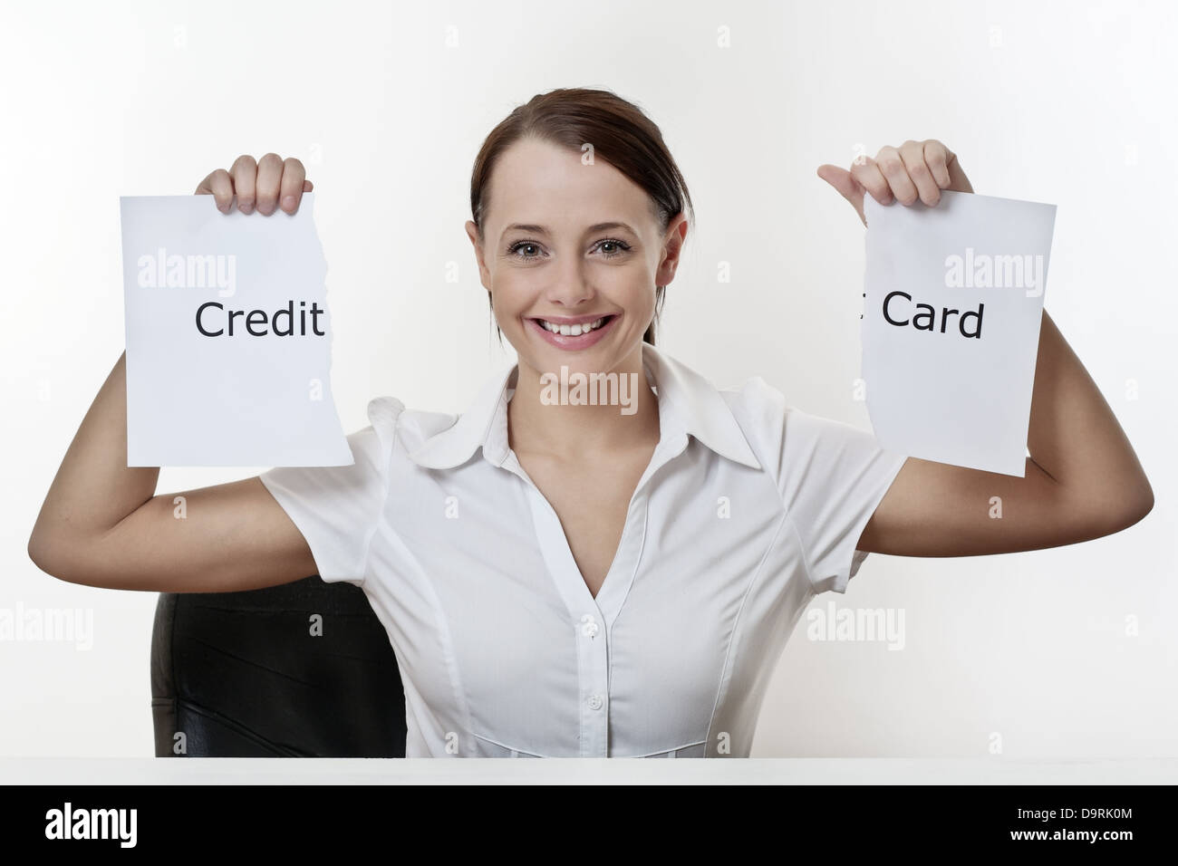 woman sitting at a desk getting saying no to credit card Stock Photo ...