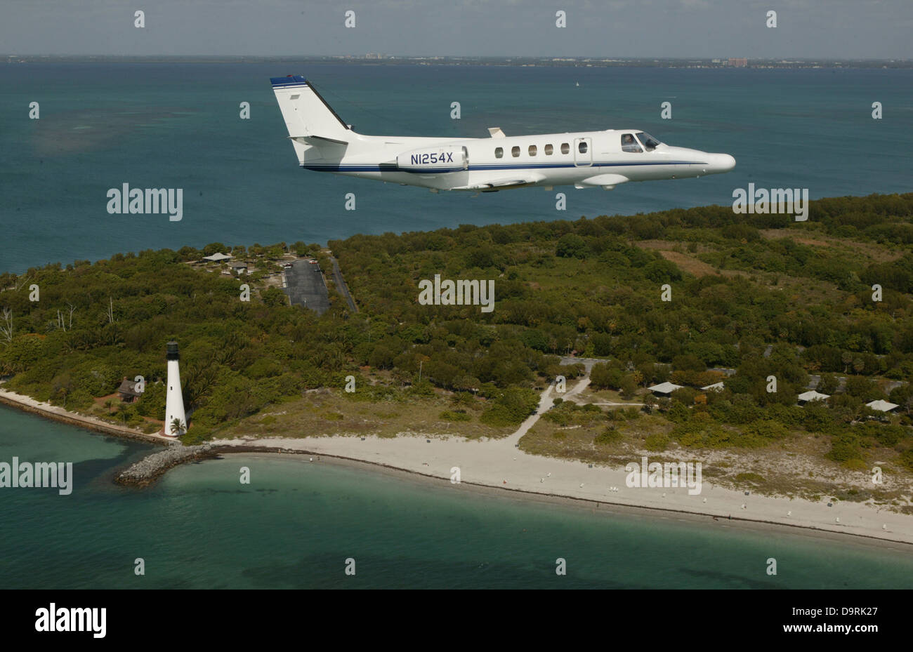 A CBP Air unit Citation Jet is shown patrolling the waters near a ...