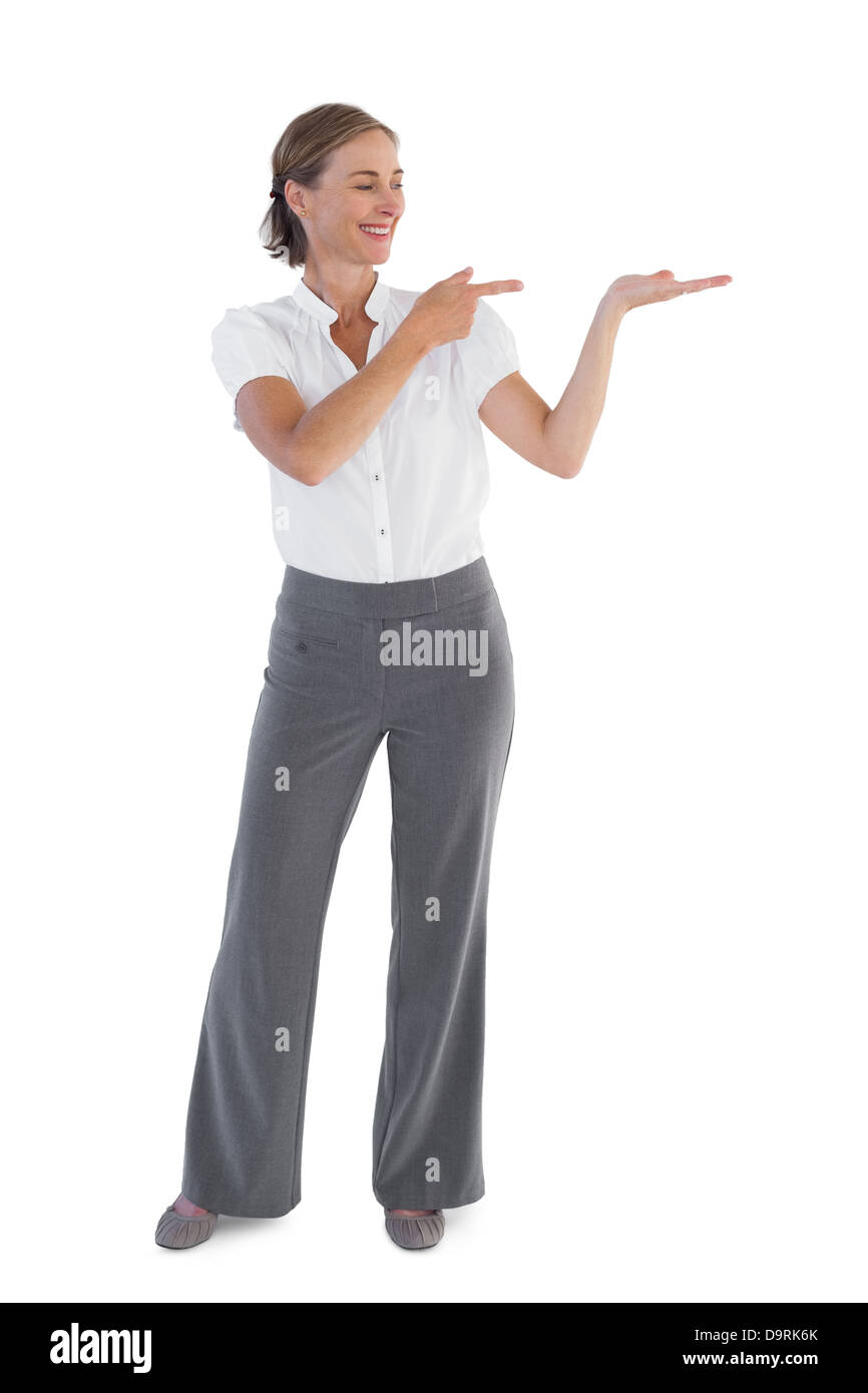 Businesswoman presenting something Stock Photo - Alamy