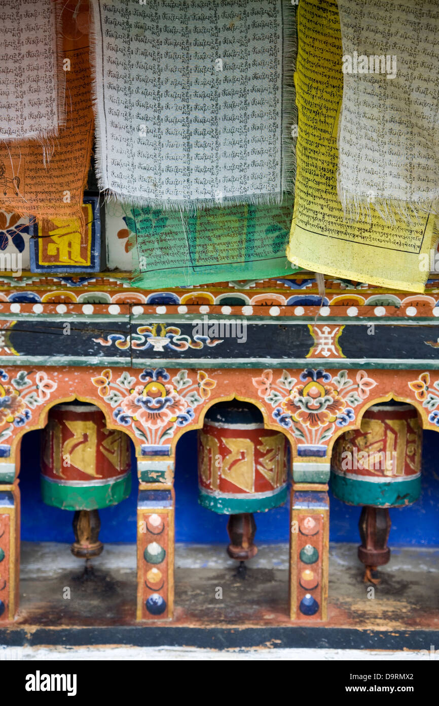 Prayer wheels and flags are colorful elements of a small Buddhist ...