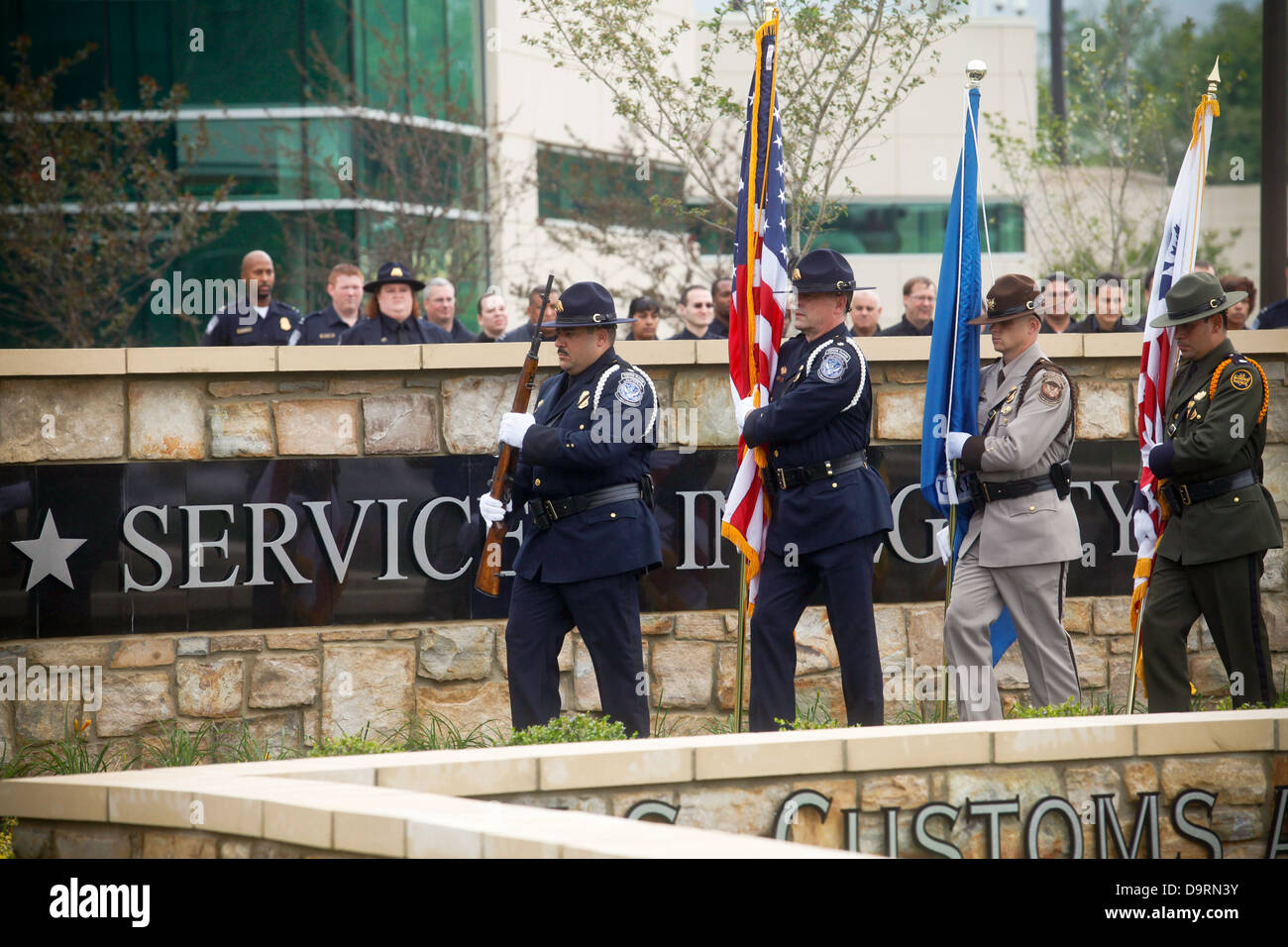 This image shows the dedication of the CBP Global College Memorial, an ...