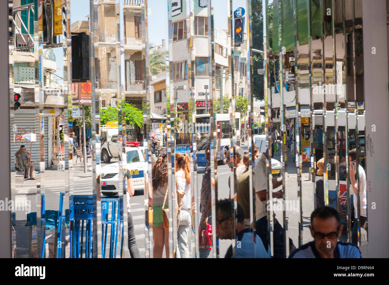 Israel Tel Aviv Carmel Market reflection road pedestrians cars modern ...