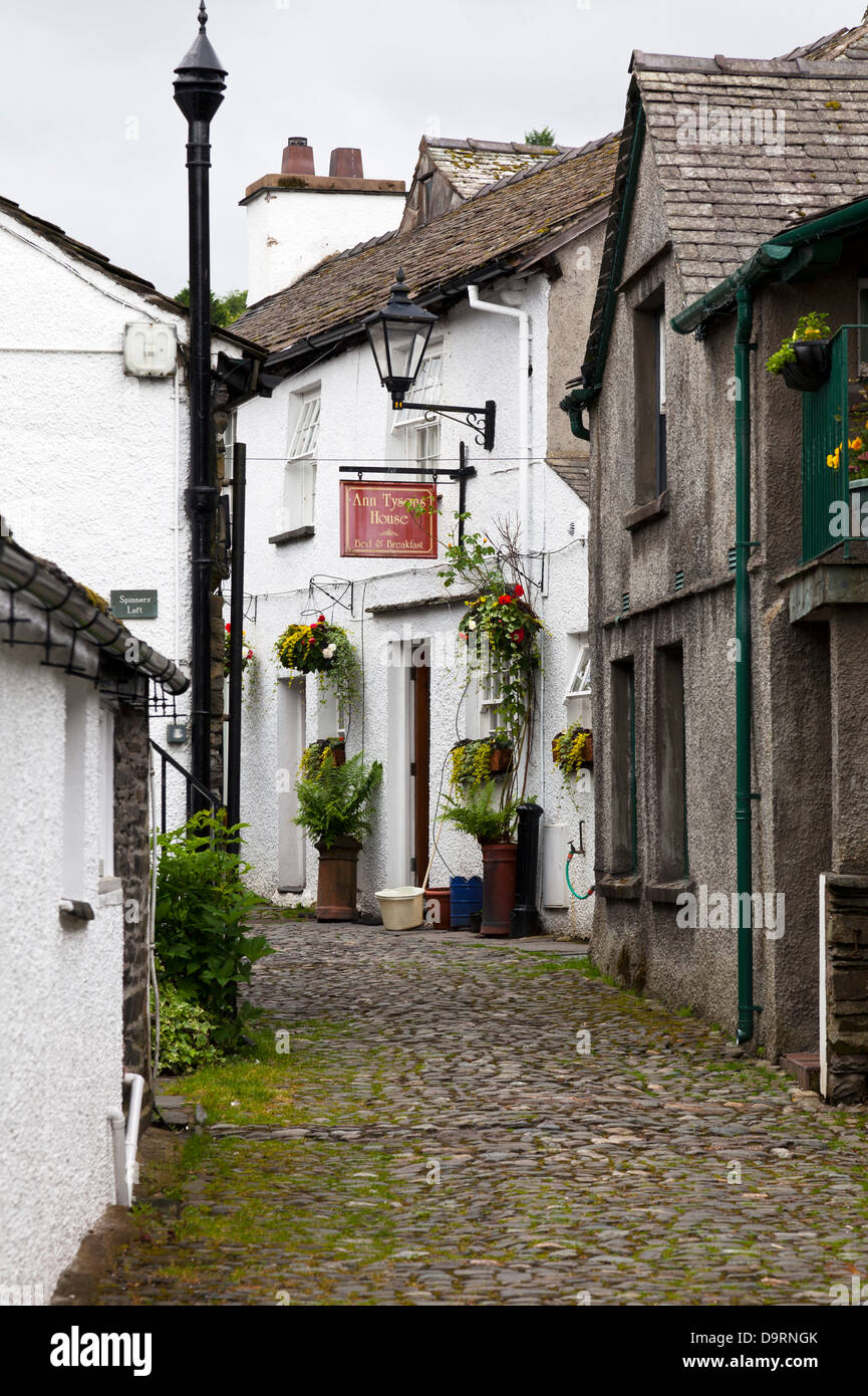 Hawkshead narrow cobbled street Cumbria, Lake District national park ...