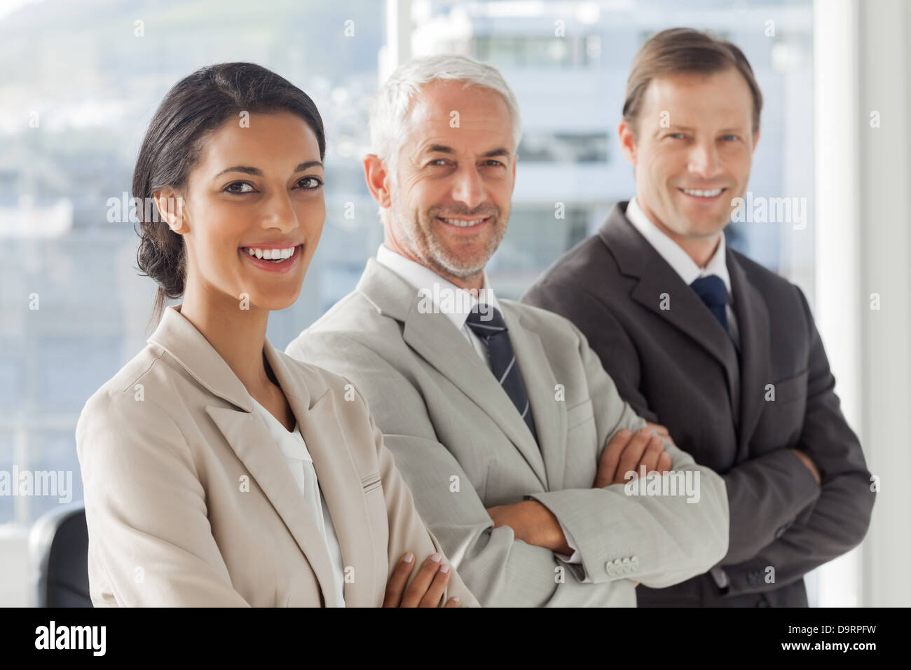 Team three successful business people hi-res stock photography and ...