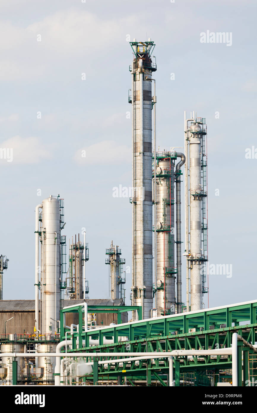 Distillation towers and pipes in a refinery during daytime Stock Photo ...
