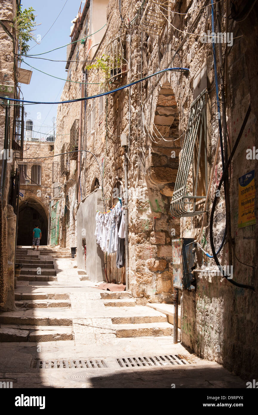 Israel Jerusalem Old City Muslim Quarter side street scene young man ...
