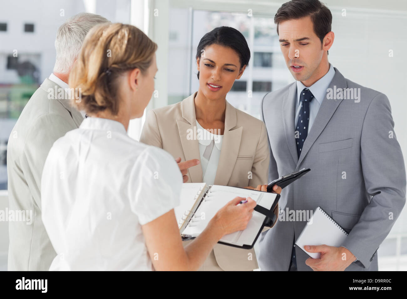 Business people making an appointment Stock Photo - Alamy