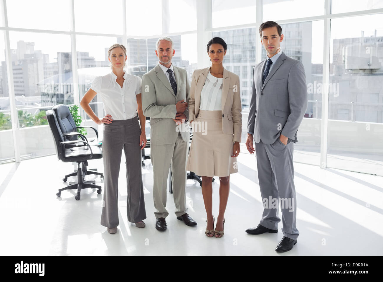Group of business people standing in line Stock Photo - Alamy