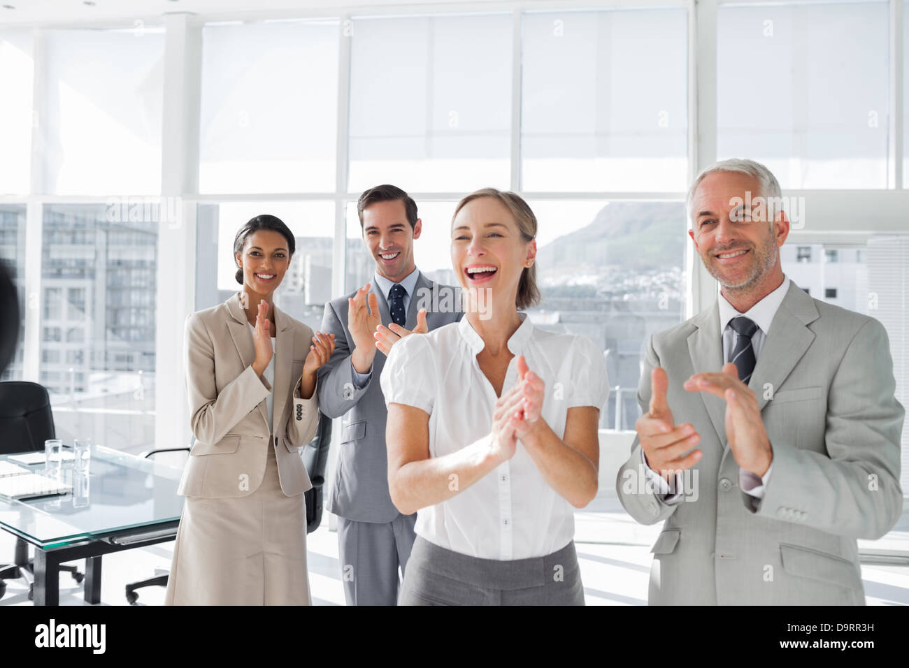 Group of business people applauding Stock Photo - Alamy